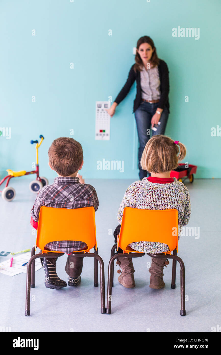 Medical check-up performed by a pediatric nurse of MCW in infant school ...