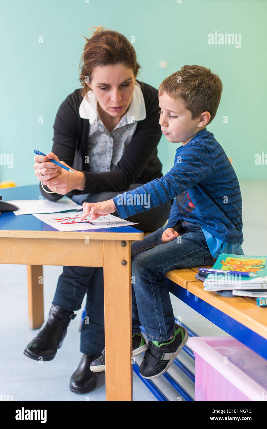 Medical check-up performed by a pediatric nurse of MCW in infant school ...