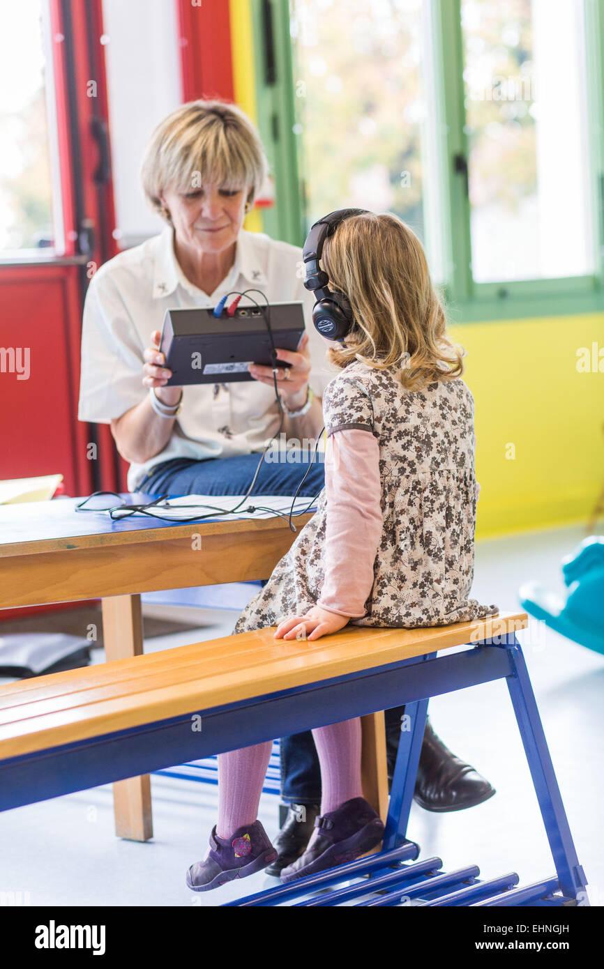 Medical check-up performed by a pediatric nurse of MCW in infant school ...