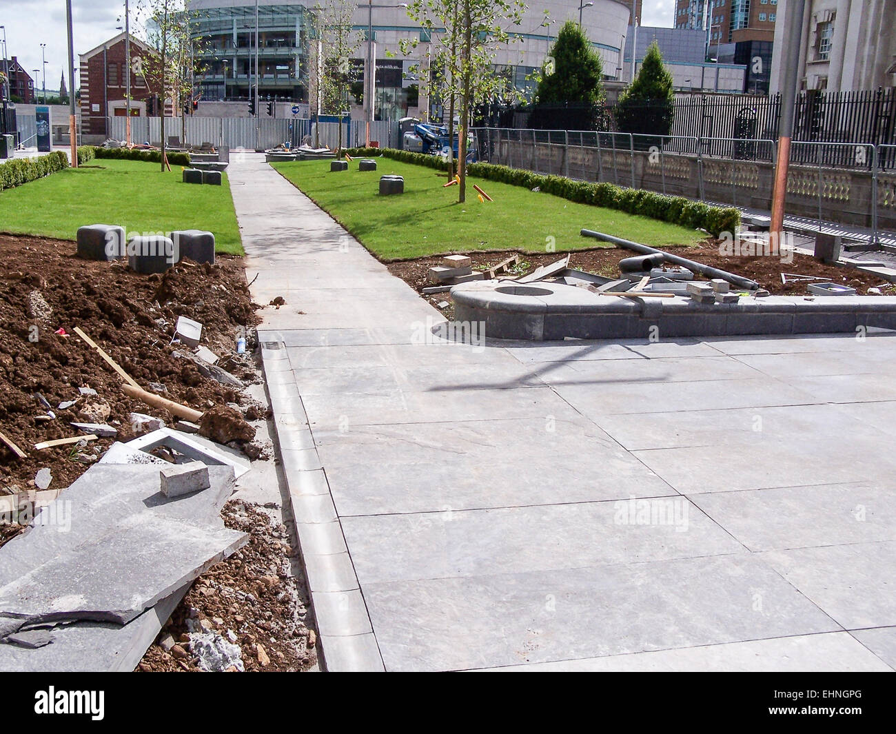 Construction of paths and grass verges of an area of public realm in ...