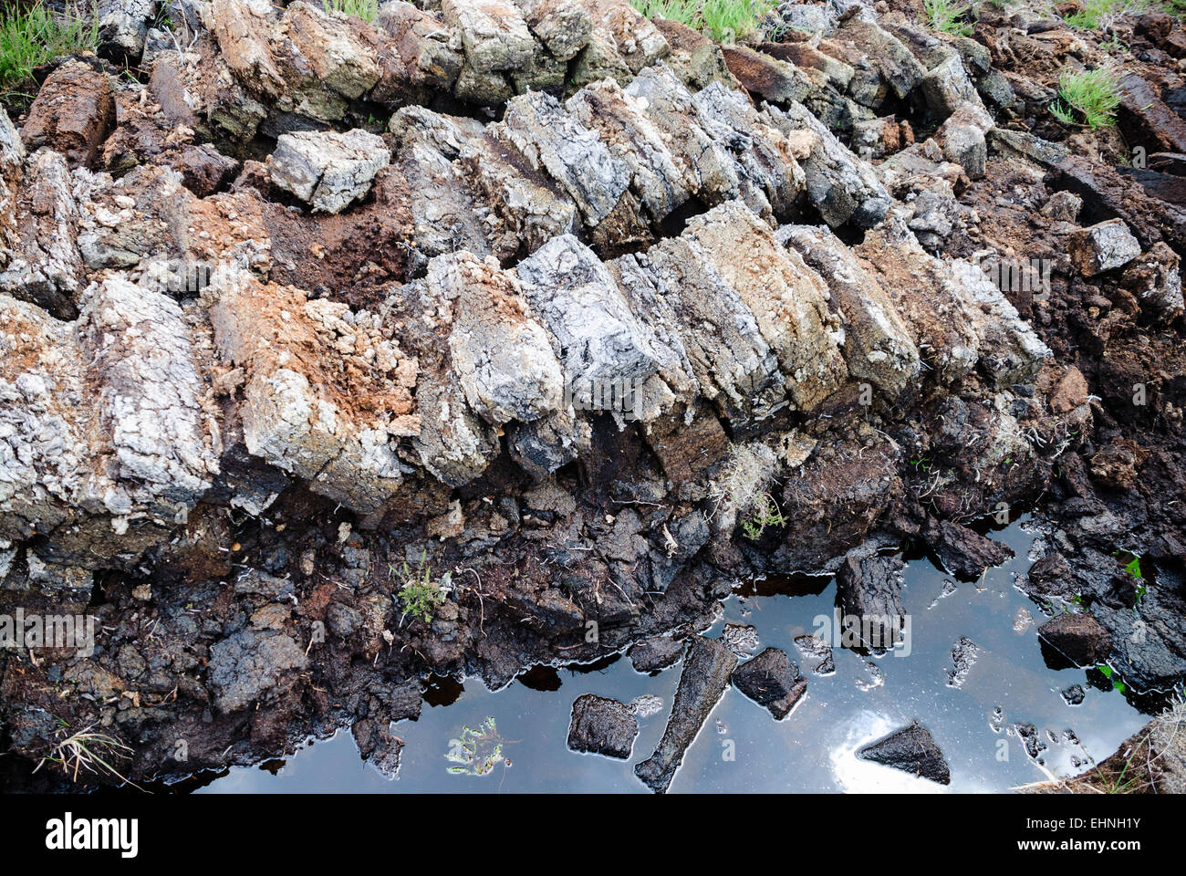Turf being cut in an Irish bog. Turf is the traditional fuel for ...
