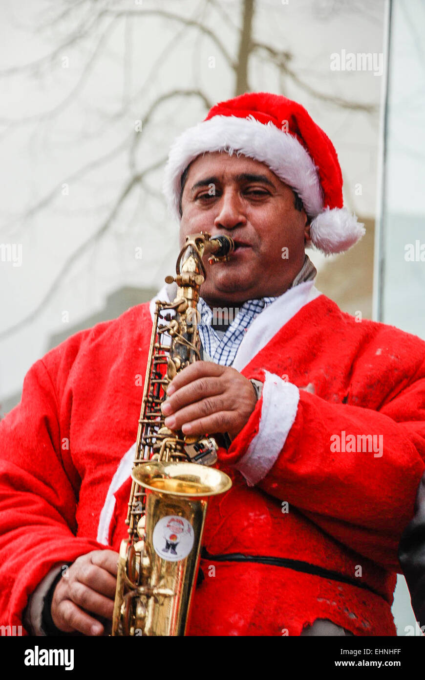 Playing saxophone christmas xmas hi-res stock photography and images ...