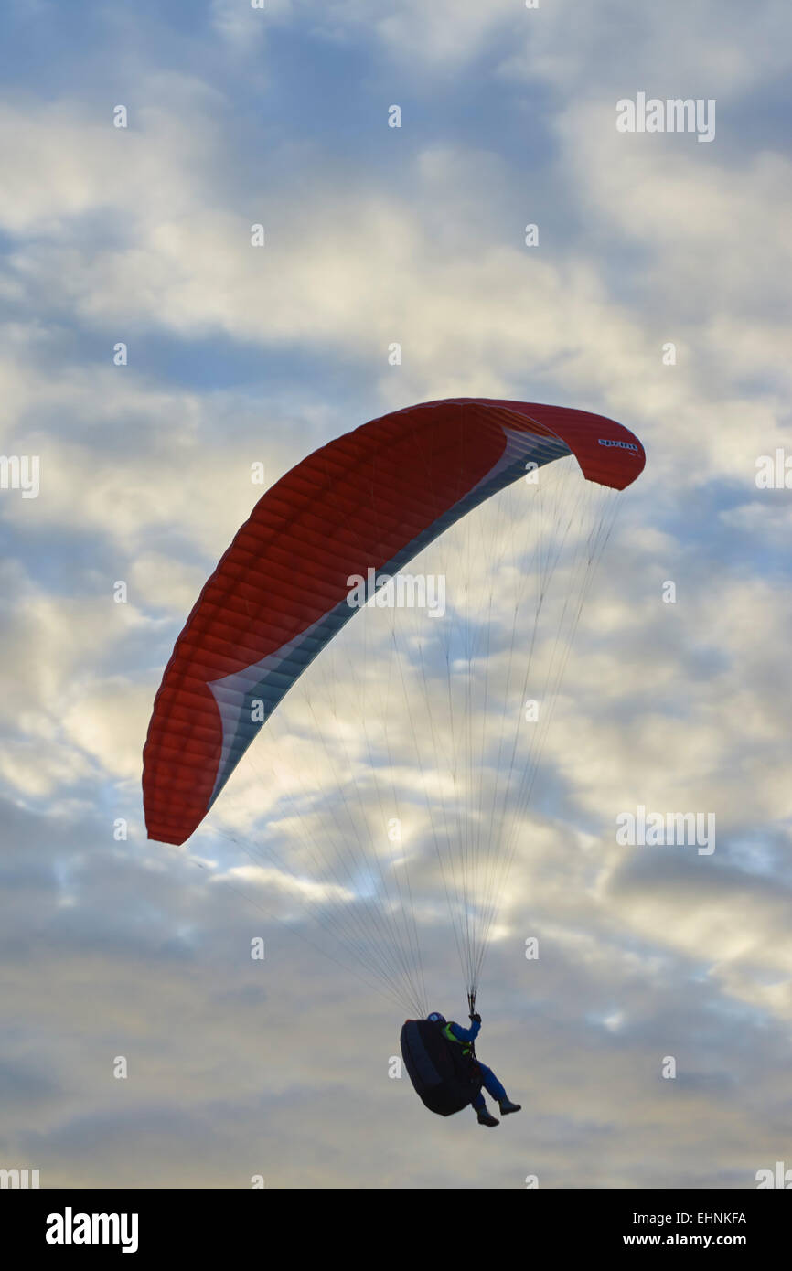 Para glider airborne against a sunset sky and sea. Aerial view Stock ...