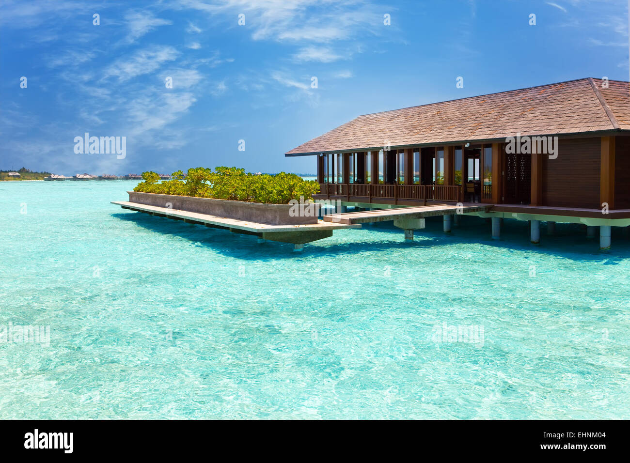 Island in ocean, overwater villa Stock Photo - Alamy