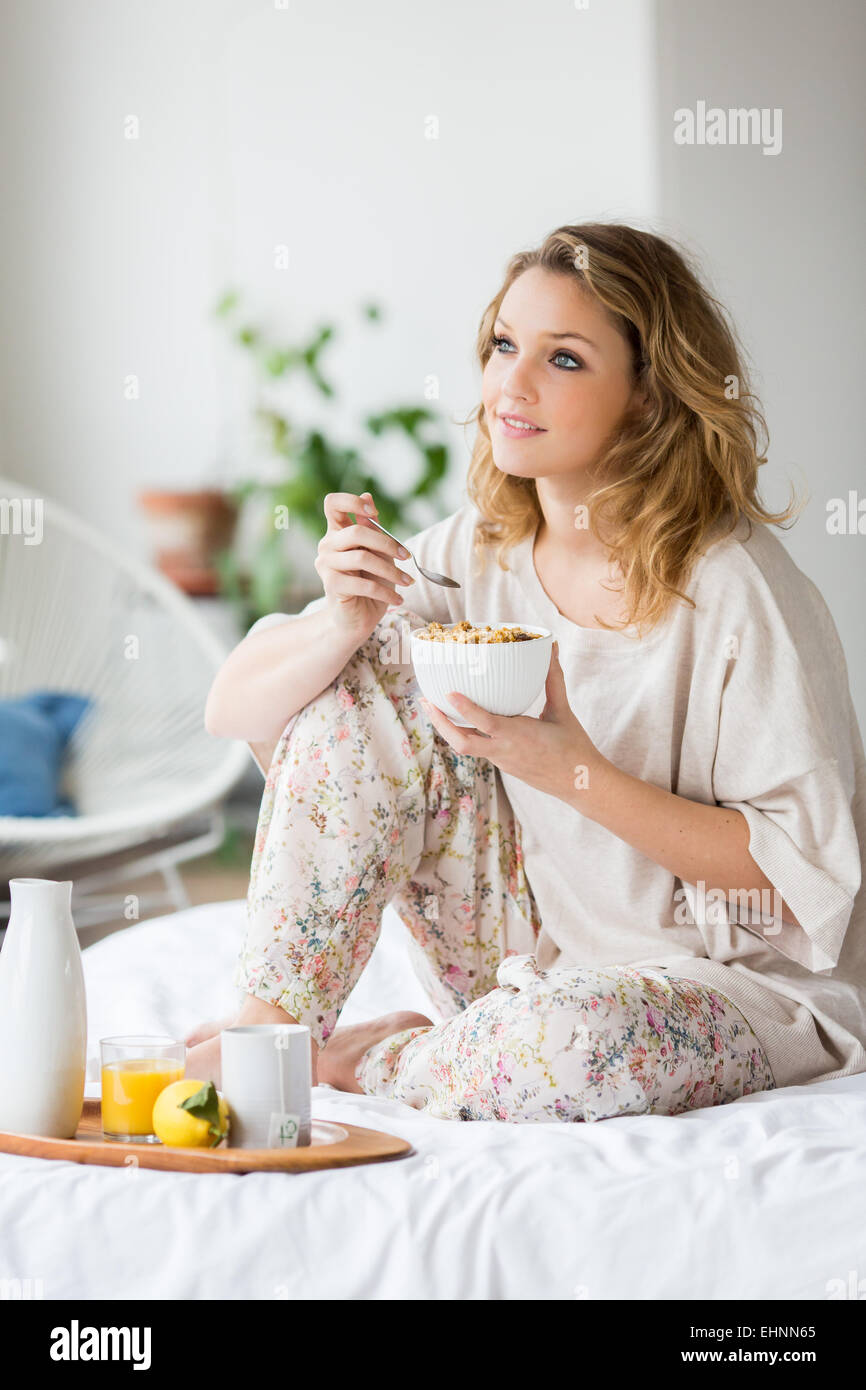 Woman having breakfast Stock Photo - Alamy
