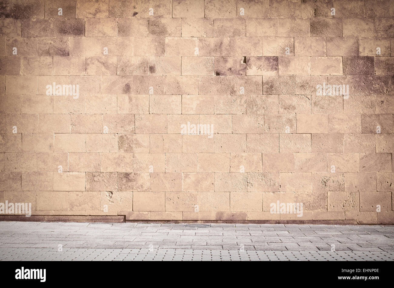 Weathered cinder block, brick wall texture with sidewalk Stock Photo ...