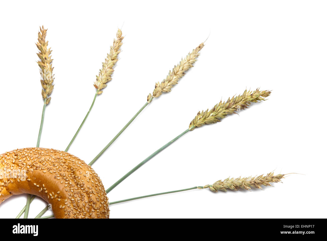 Wheat and bread on white background Stock Photo - Alamy