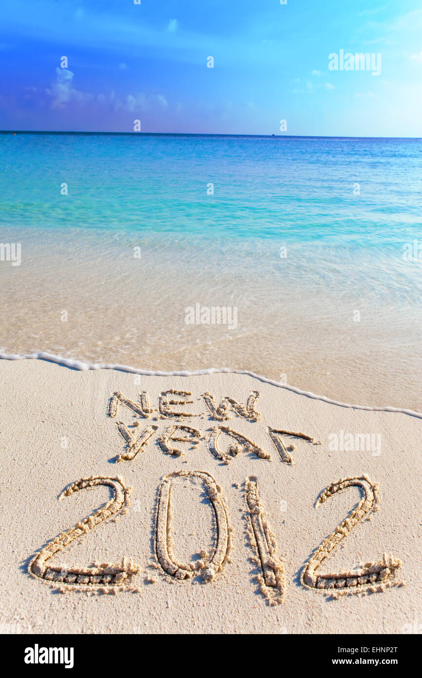 On sand at ocean edge it is written 2012 Stock Photo - Alamy