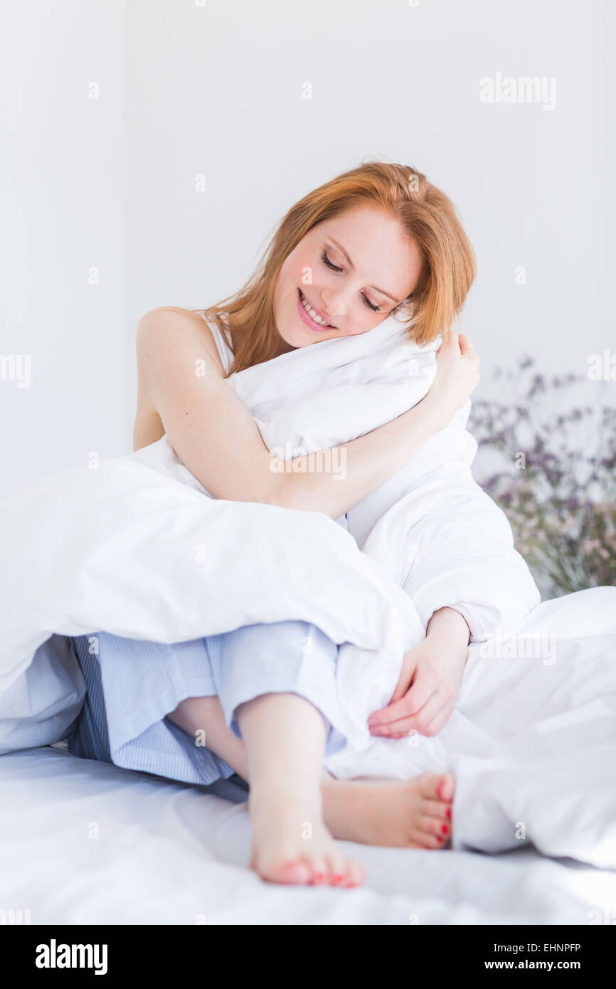 Woman resting bed Stock Photo - Alamy