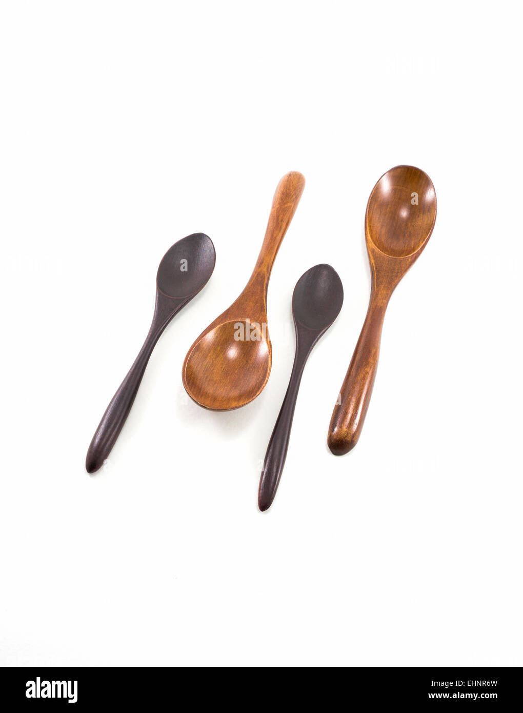 Isolated Four Light and dark Brown Wooden Spoons on White Background ...