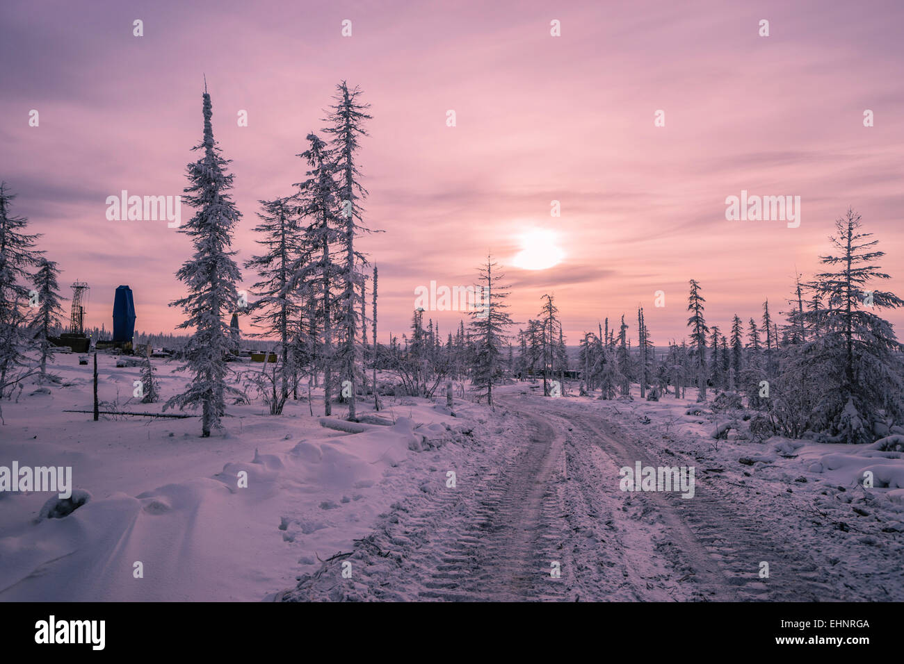 winter landscape with cloudy sky and sun and boring setting Stock Photo ...