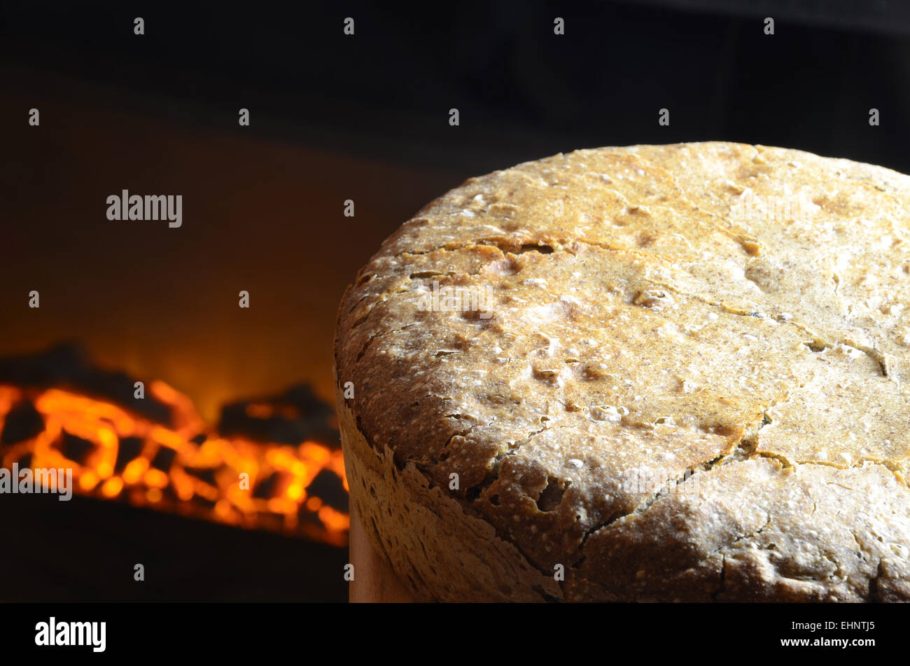 Domestic bread with fireplace in a background Stock Photo - Alamy