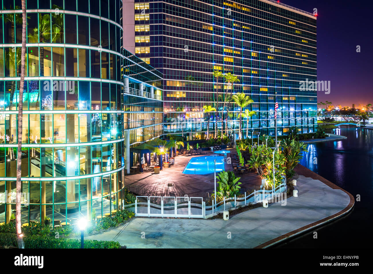 View of a modern building and Rainbow Lagoon Park at night, in Long ...