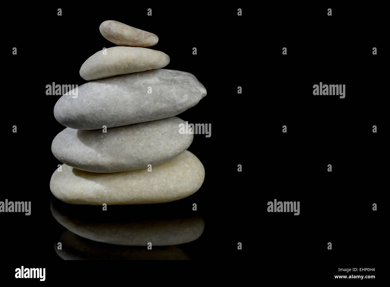 Stones stacked isolated black background with reflection Stock Photo ...