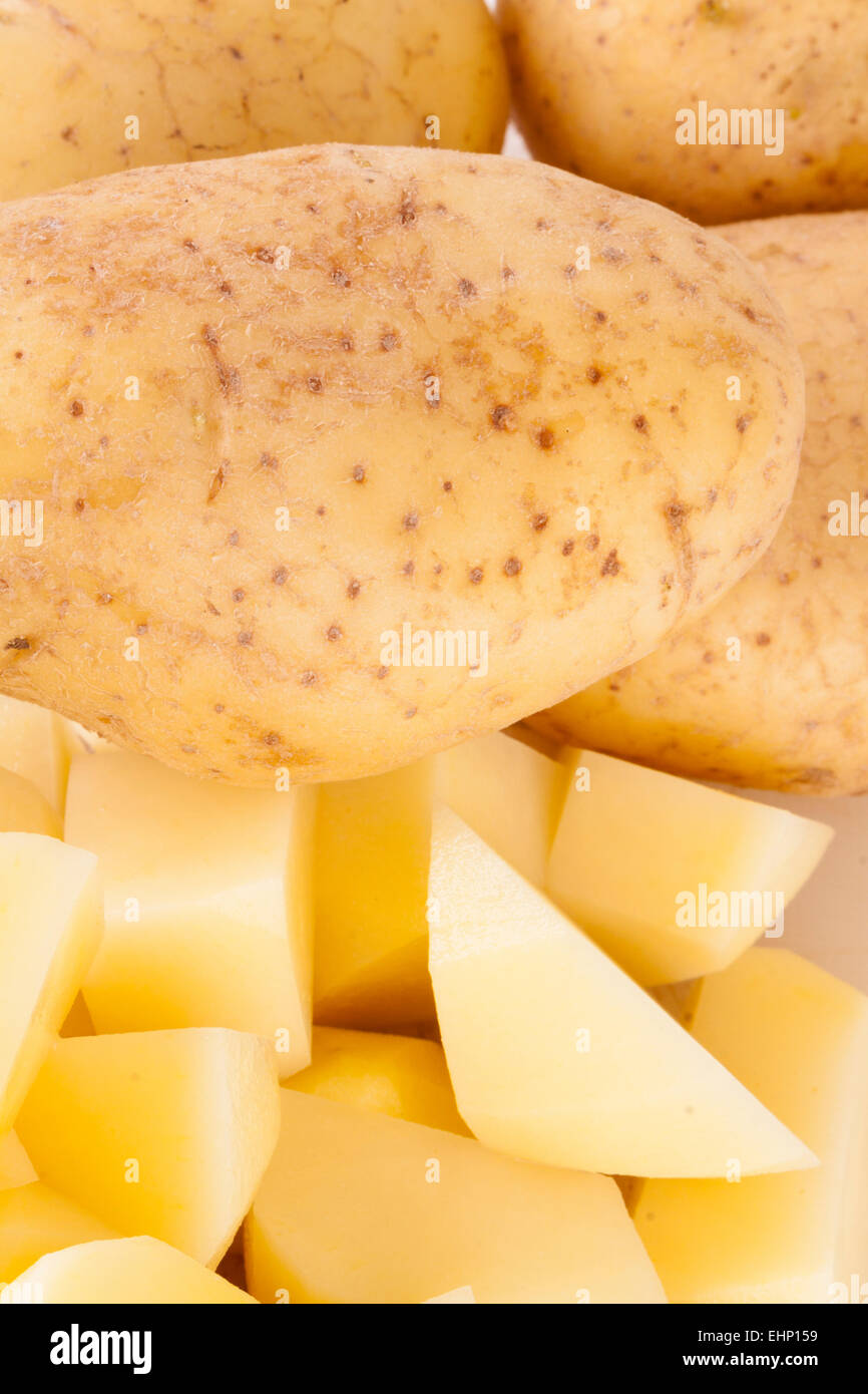 Farm fresh baby potatoes displayed on a hessian sack on a rustic wooden ...