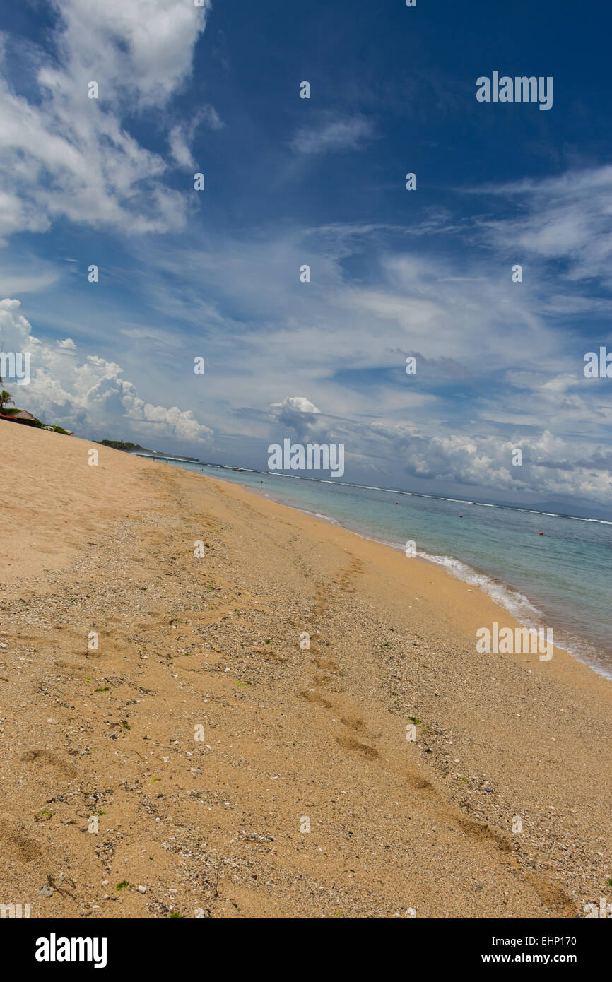 Beautiful tropical beach with lush vegetation fringing golden sand and ...