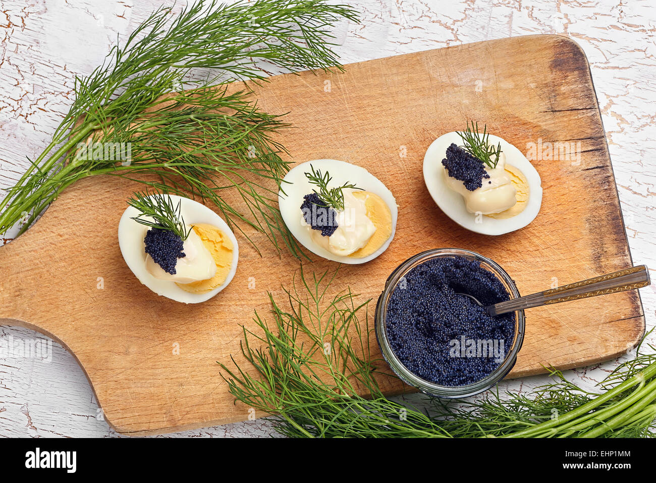 Easter eggs with mayonnaise and caviar Stock Photo - Alamy
