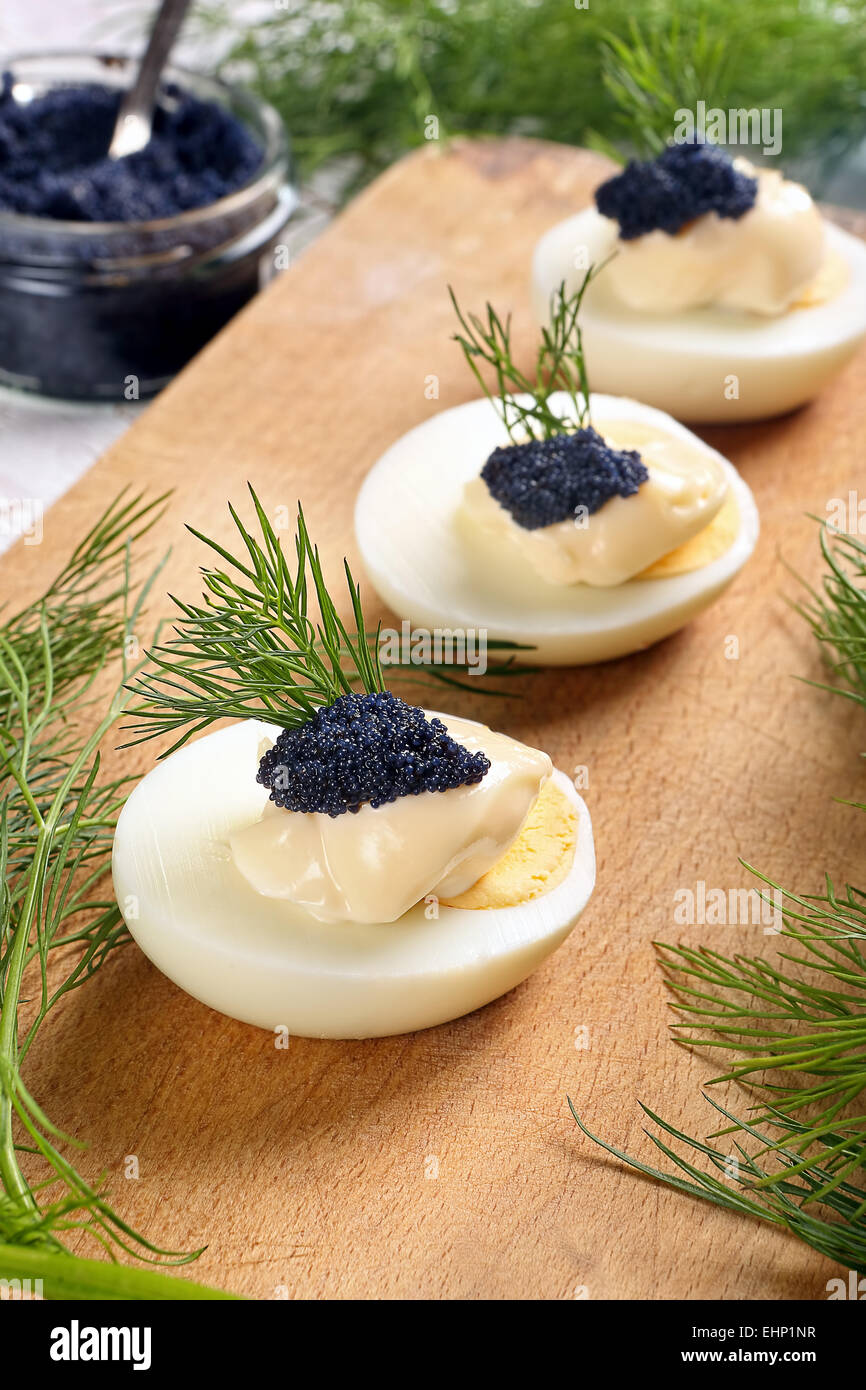 Easter eggs with mayonnaise and caviar Stock Photo - Alamy