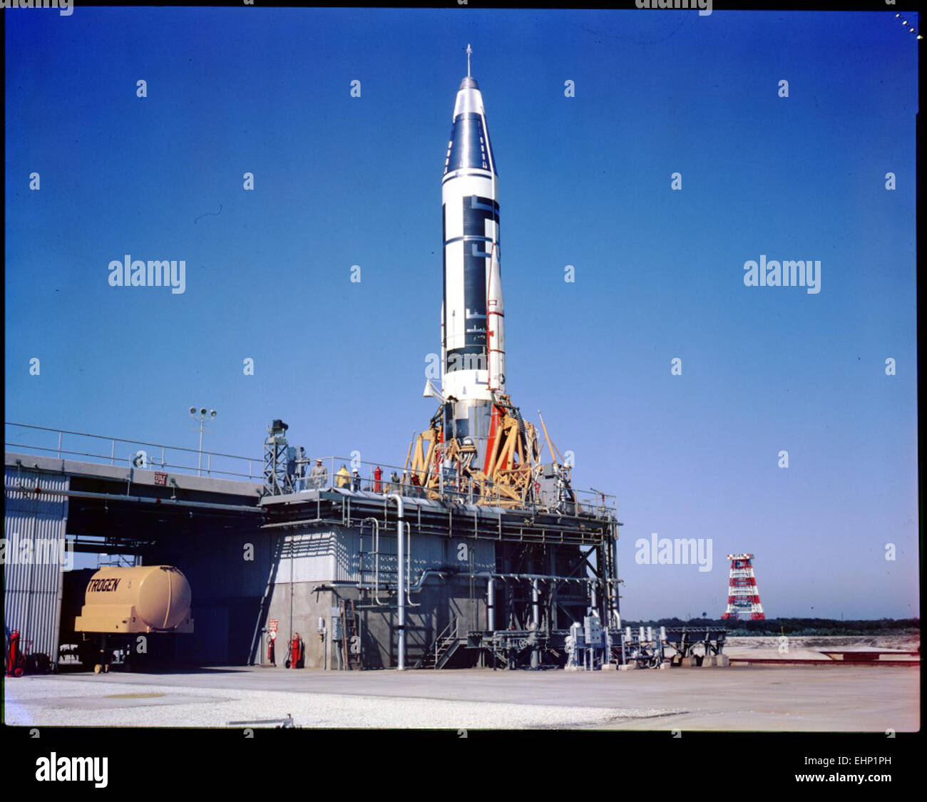 This photograph shows an Atlas 10A missile on its launch pad with the ...