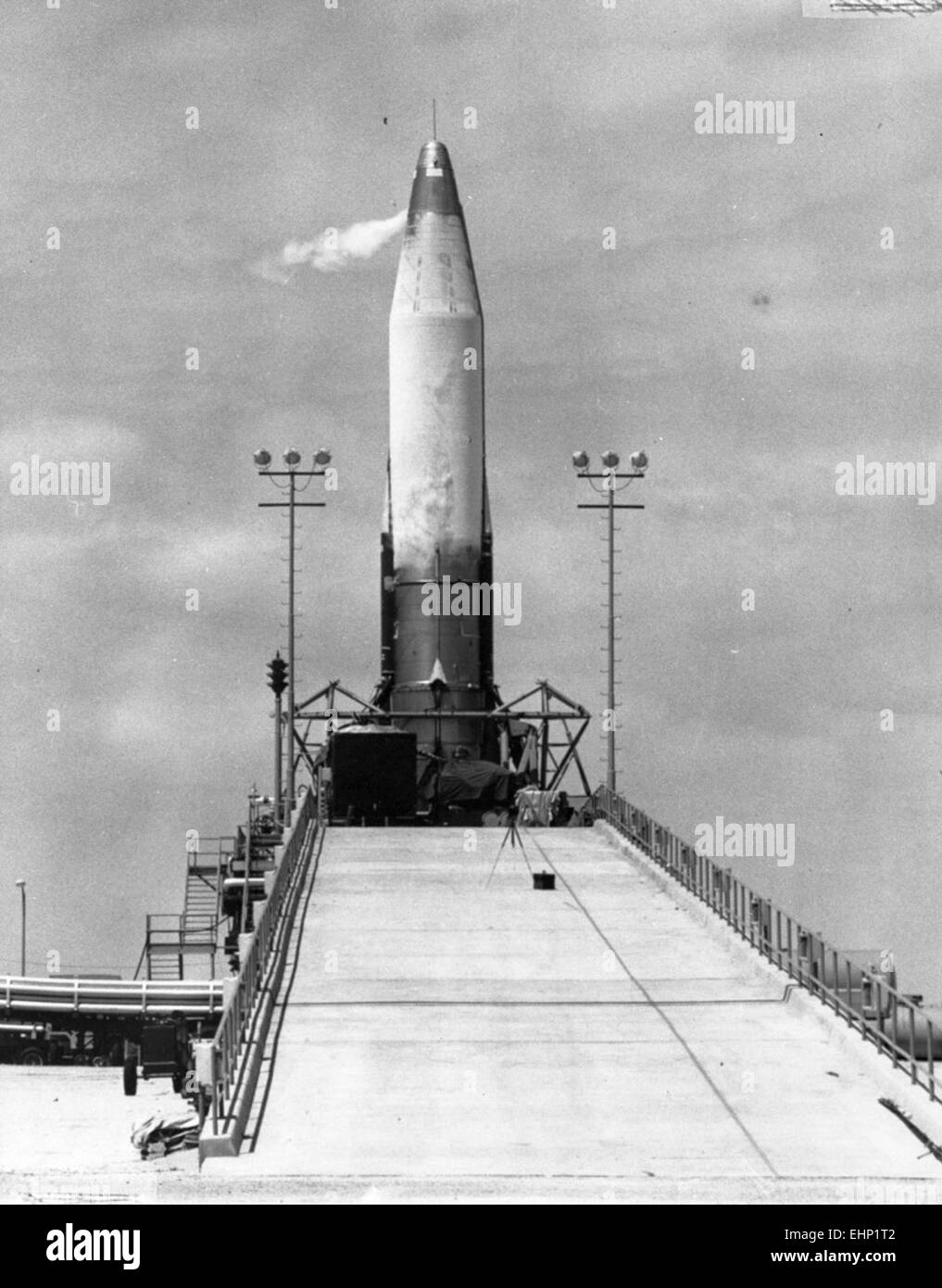 This photograph shows the Atlas 13E rocket on its launch pad, with the ...