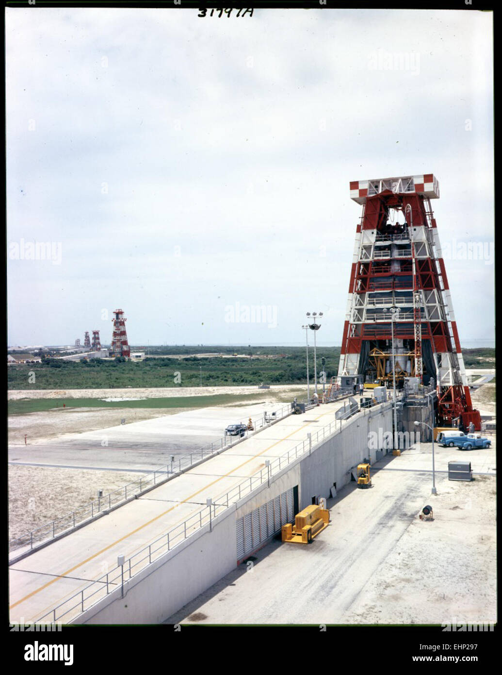 Photograph of an Atlas missile on the launch pad, showing the tower ...