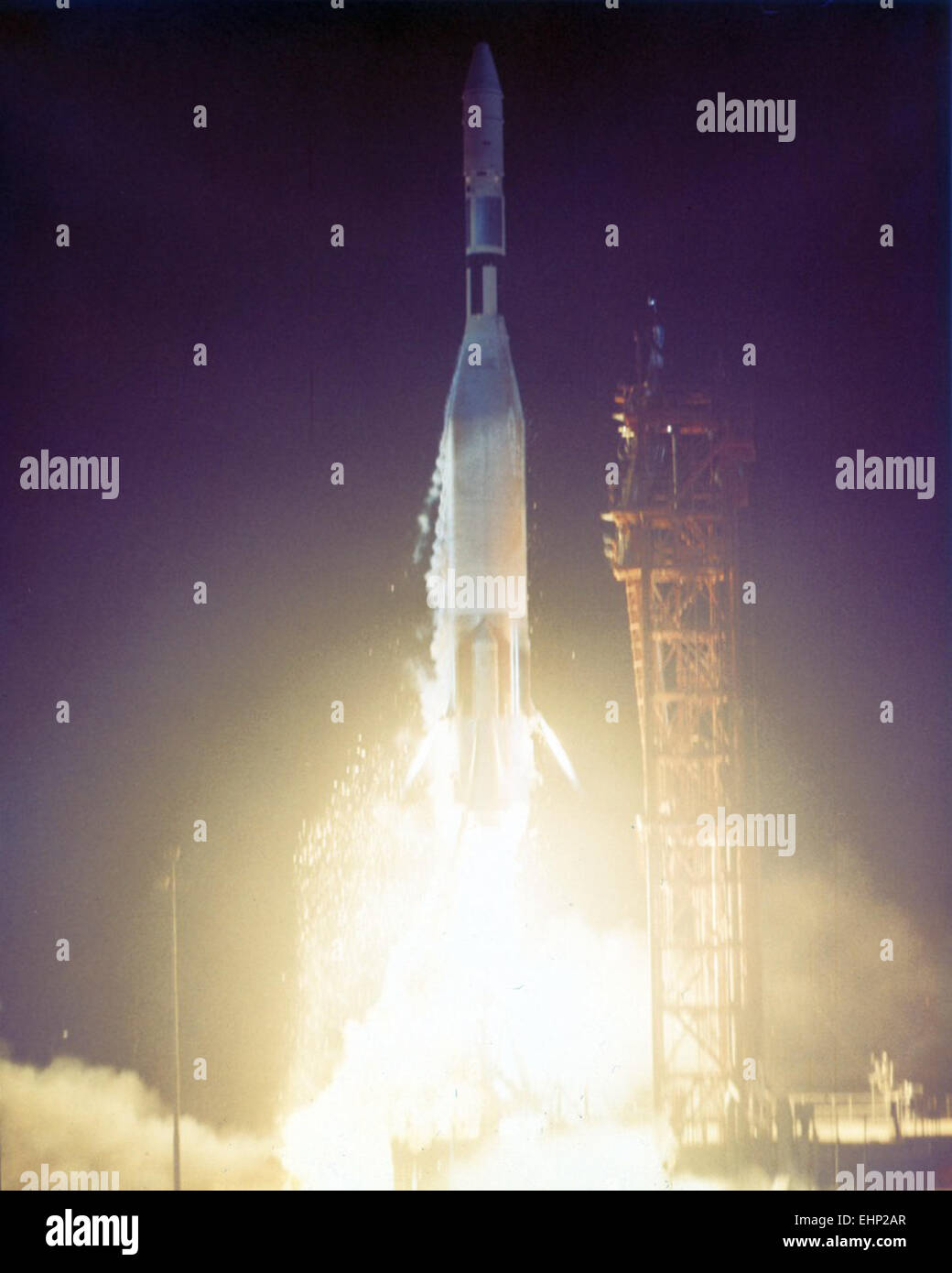 A photograph of the Atlas-Agena rocket liftoff, part of the Ranger and ...