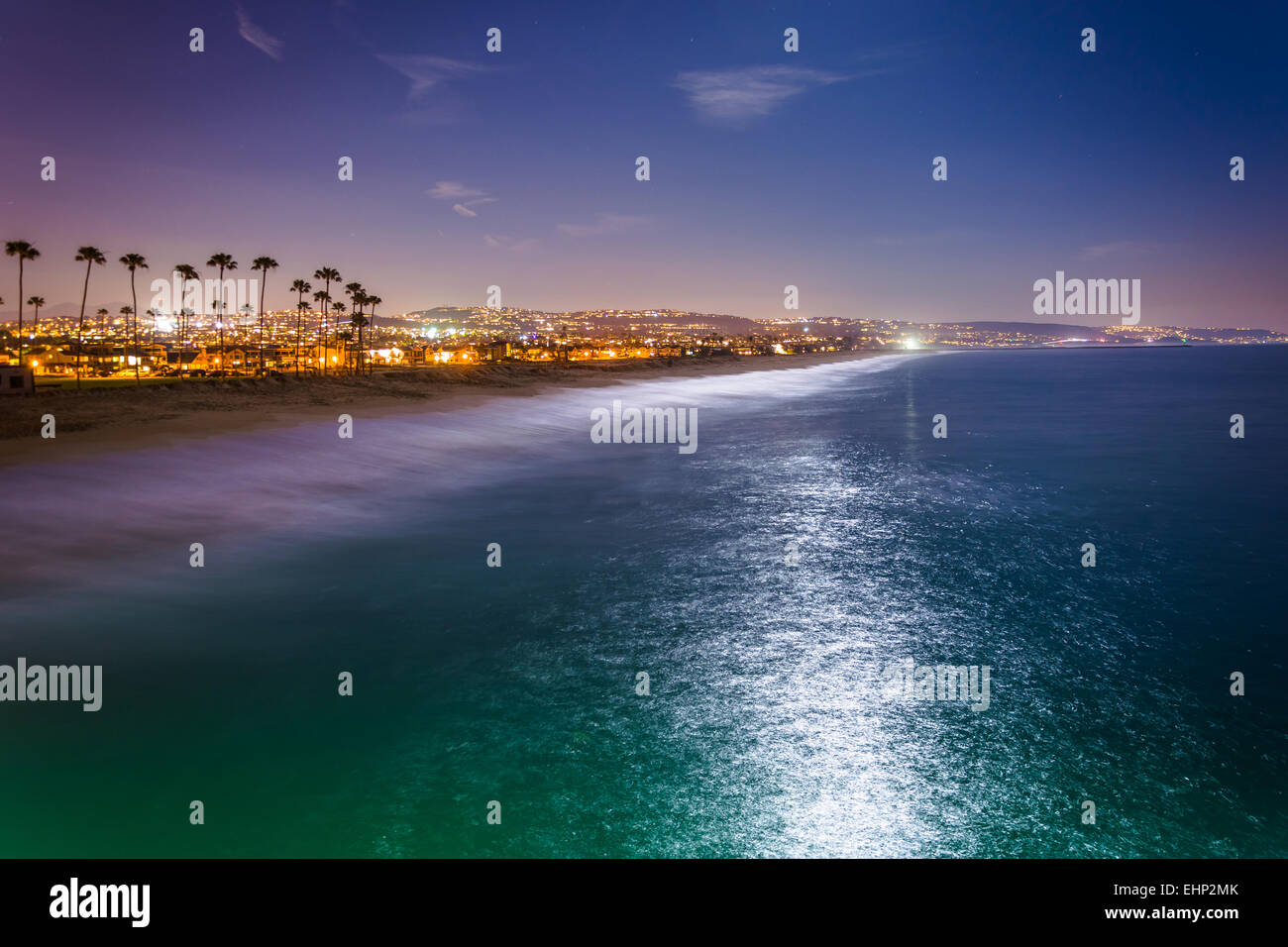 View of the beach and Pacific Ocean at night, from Balboa Pier in ...