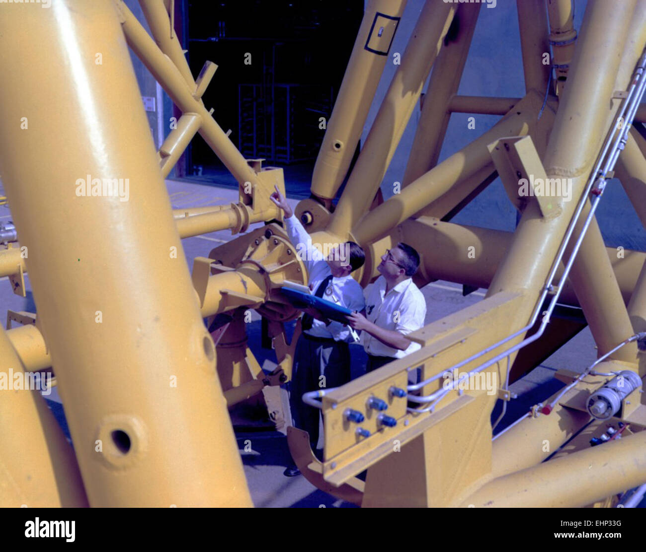 A photograph of engineers working with a launcher for an astronomical ...