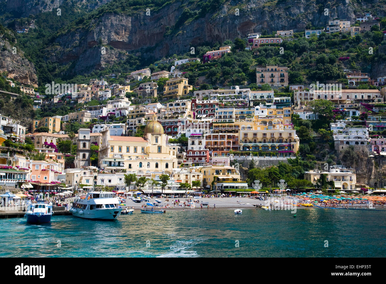 Positano beach with colorful buildings and cliffs hi-res stock ...