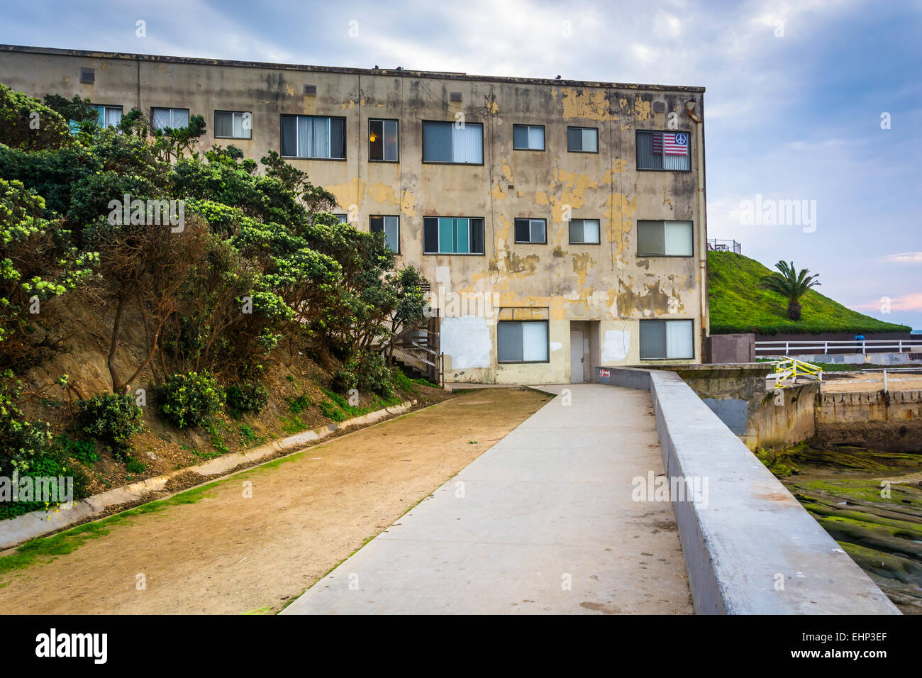 Walkway and run-down apartment building in Ocean Beach, California ...