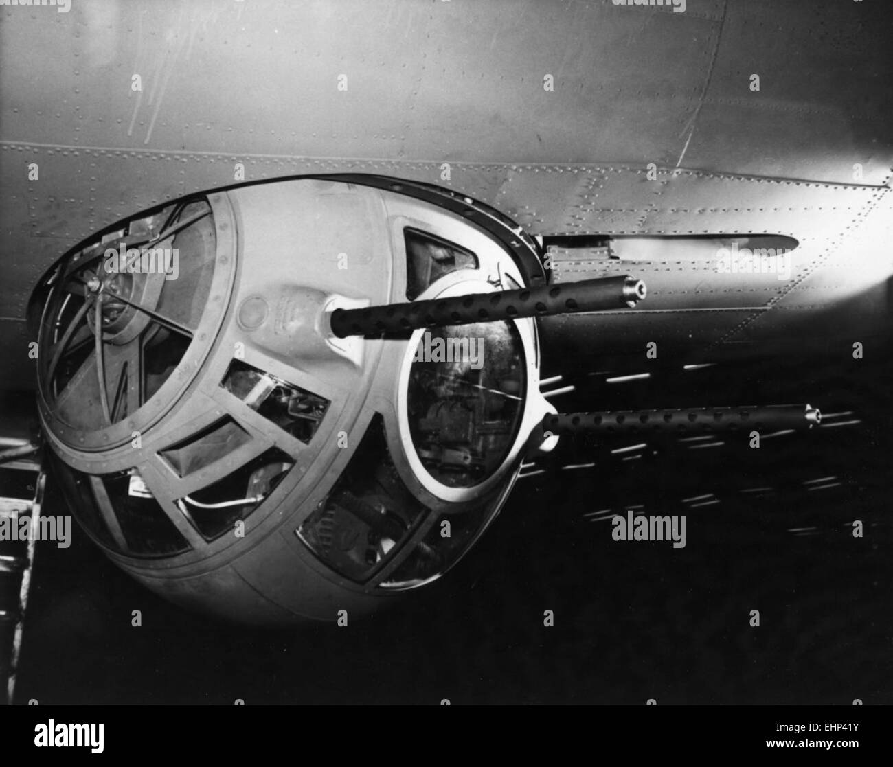 This photograph shows the installation of the Briggs-Sperry ball turret ...