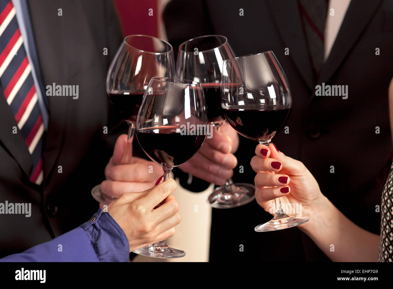 Hands toasting glasses red wine hi-res stock photography and images - Alamy