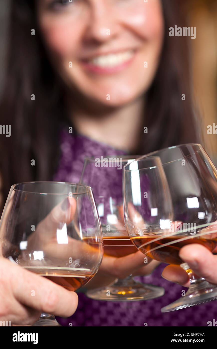 Liquor glasses clinking hi-res stock photography and images - Alamy