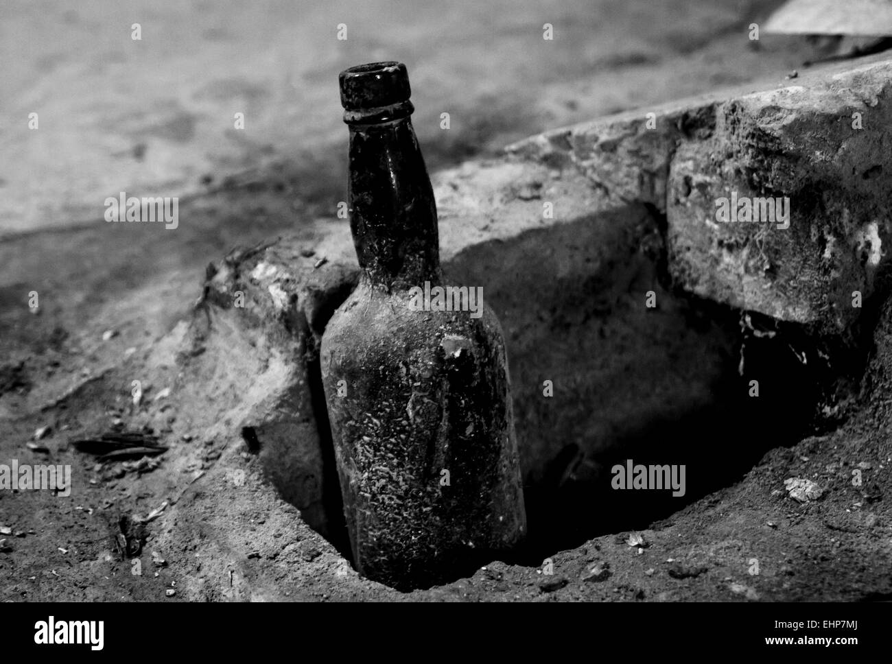 Bottle in a hole Black and White Stock Photos & Images - Alamy