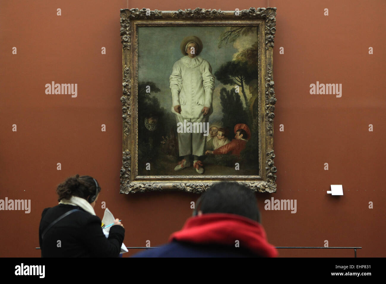 Visitors in front of the painting 'Pierrot' ('Gilles') by French Rococo ...