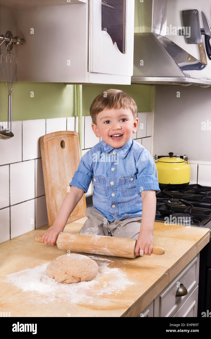 Boy sitting on counter hi-res stock photography and images - Alamy