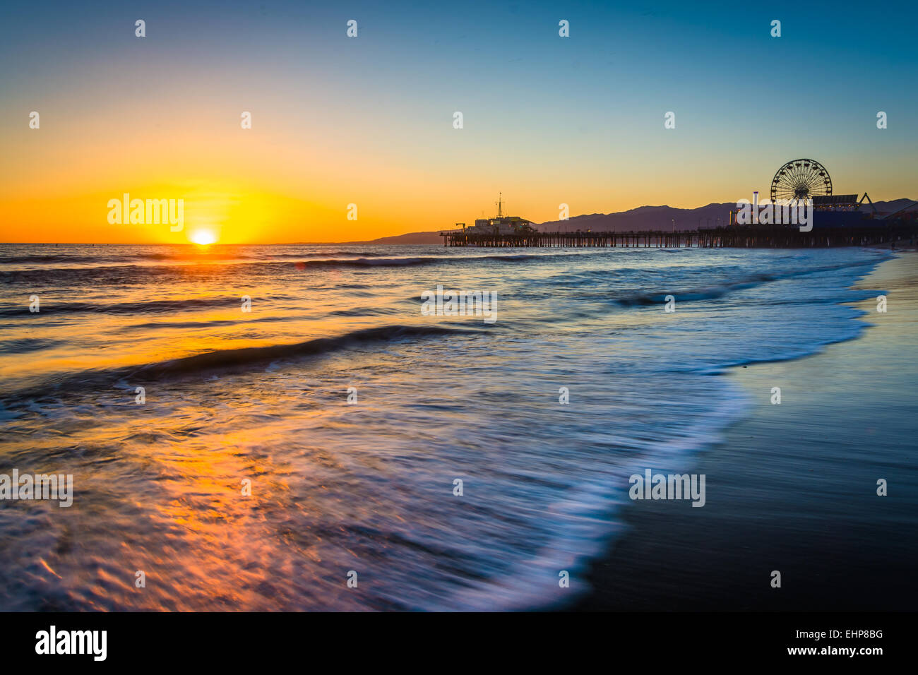 Sunset over the Pacific Ocean and Santa Monica Pier, in Santa Monica ...