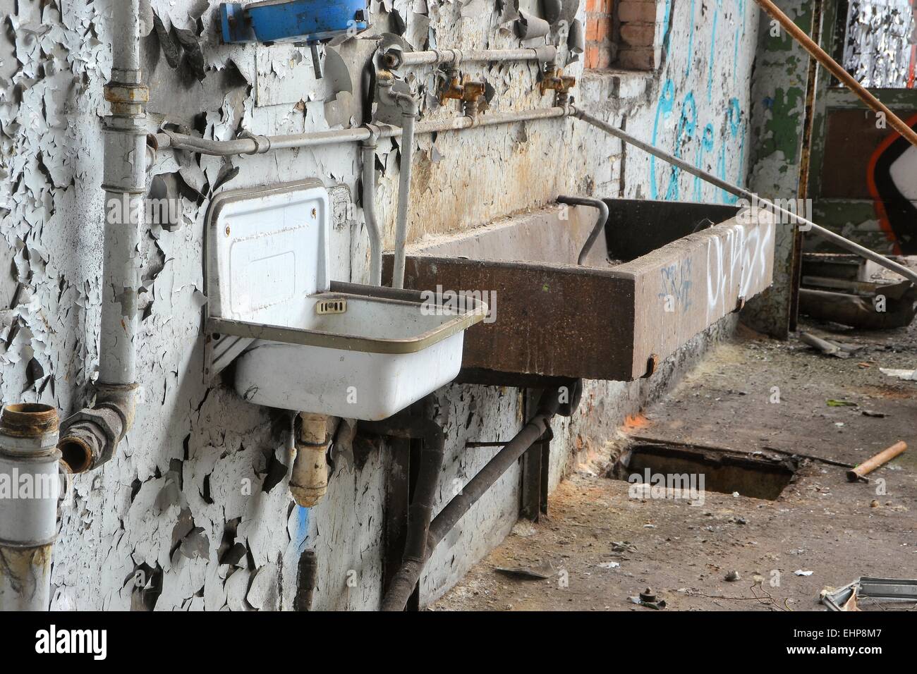 Washbasins in a disused factory Stock Photo - Alamy