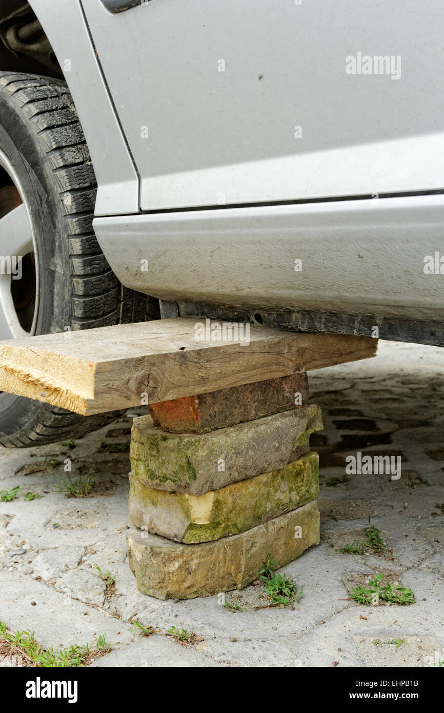 Car lifted up Stock Photo - Alamy