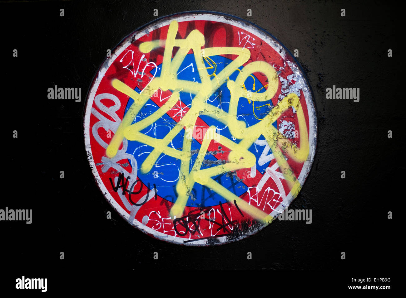 Tags and graffiti on a road sign Stock Photo - Alamy