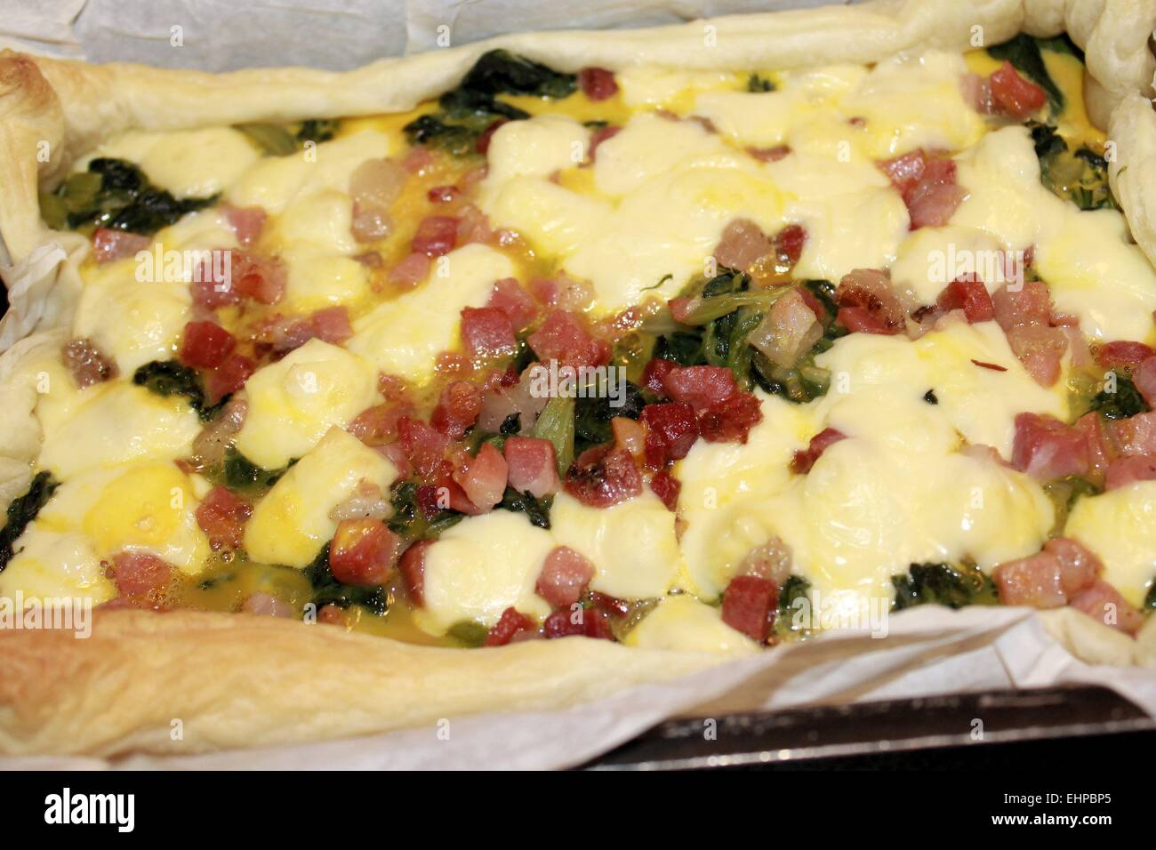 Italian savory pie with bacon, fontina cheese, eggs and herbs Stock ...
