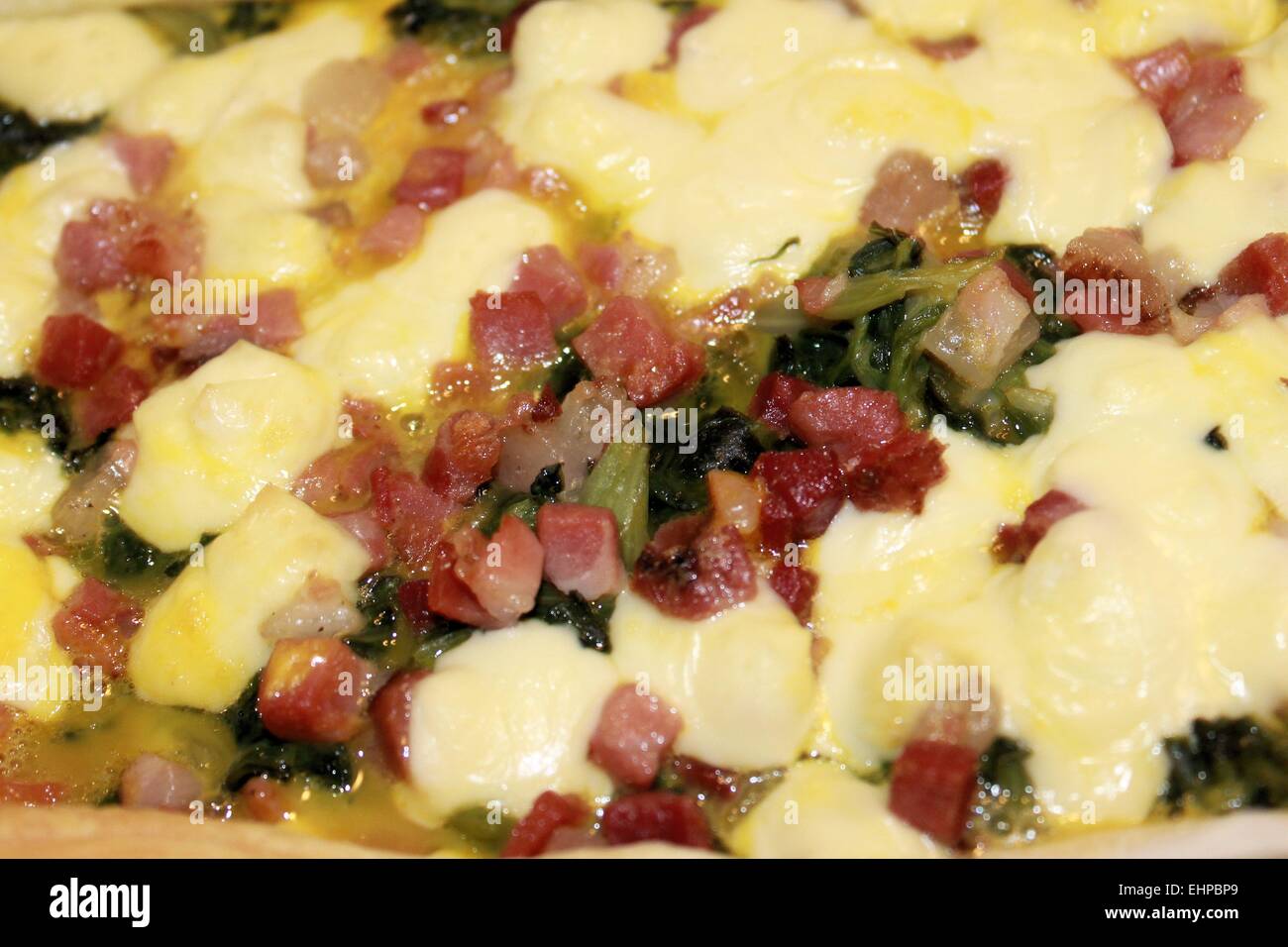 Italian savory pie with bacon, fontina cheese, eggs and herbs Stock ...