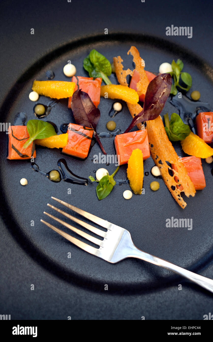 Salmon, orange, parsnip puree and toast on a plate Stock Photo - Alamy