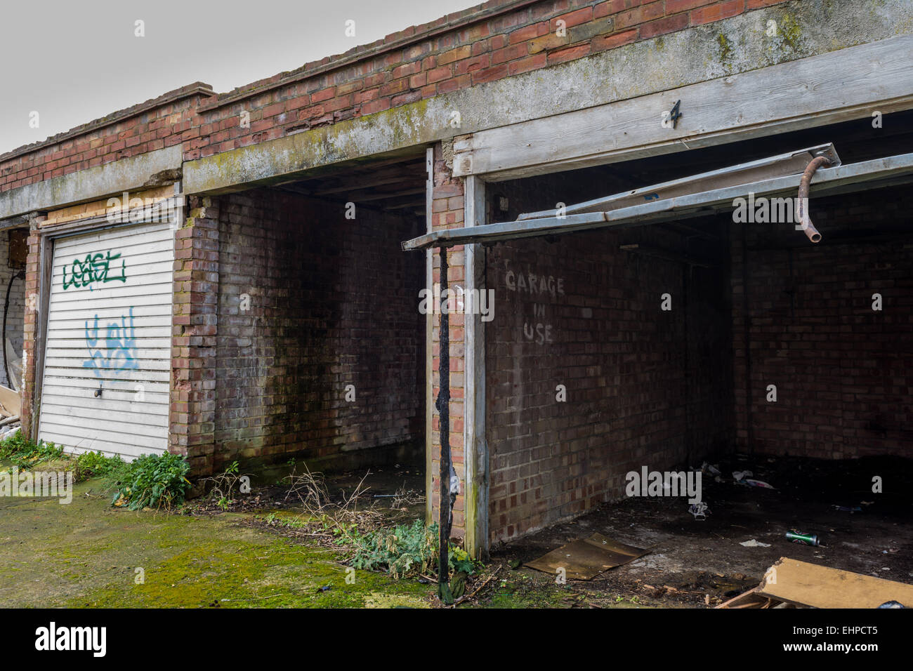 Abandoned garages (with sign saying Garage in use) North London Stock ...