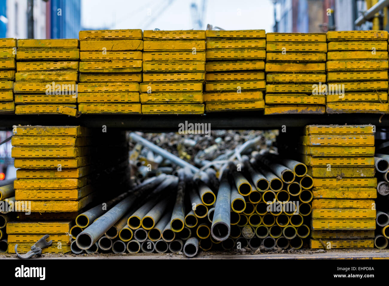 Yellow scaffolding boards and poles on a lorry Stock Photo - Alamy