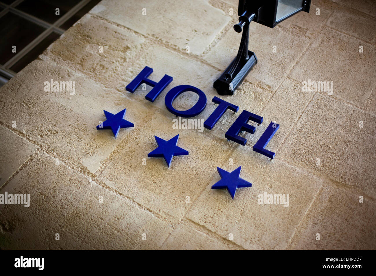 Stoned facade of a three stars hotel Stock Photo - Alamy