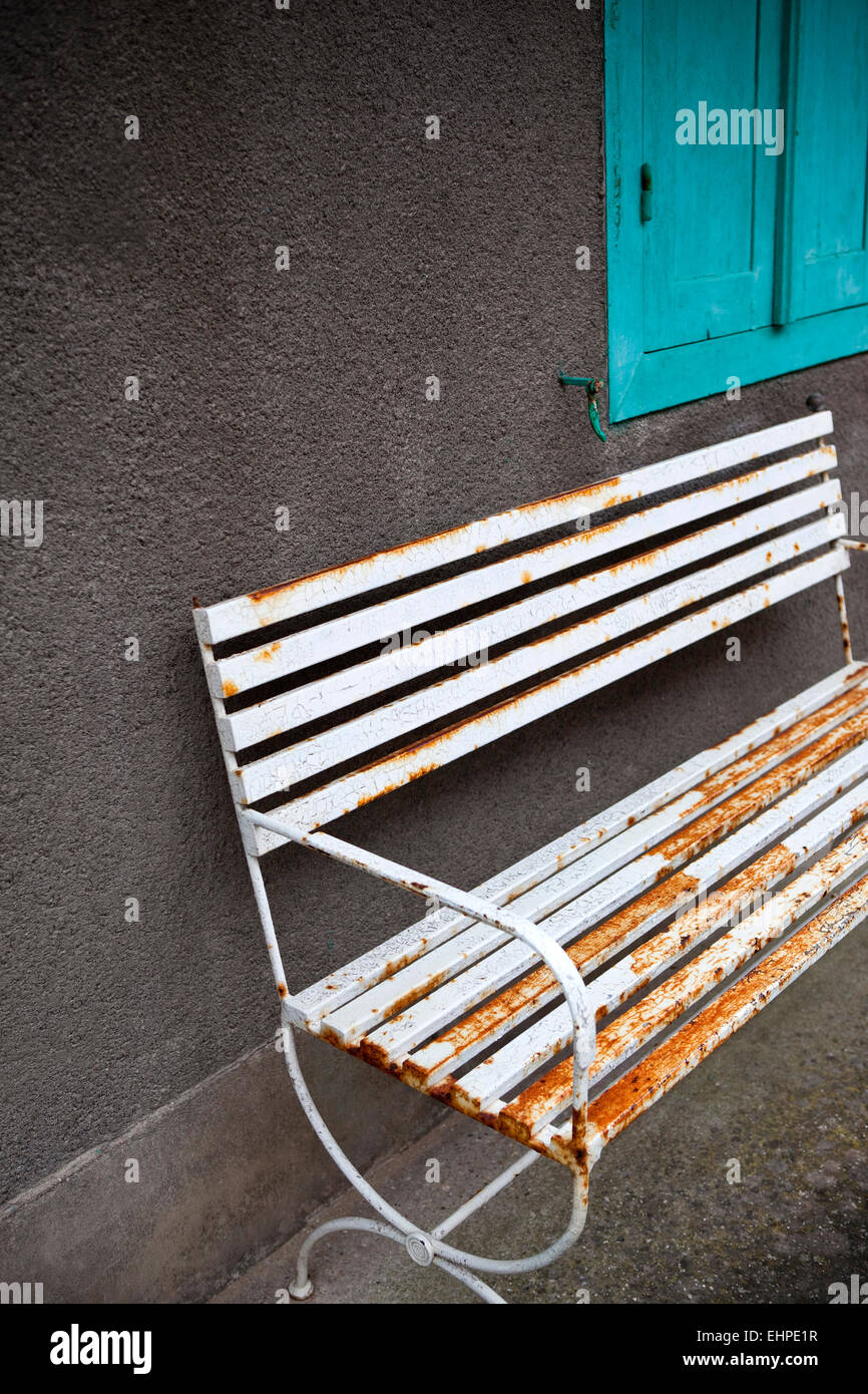 Old rusty metal bench on a terrace Stock Photo - Alamy