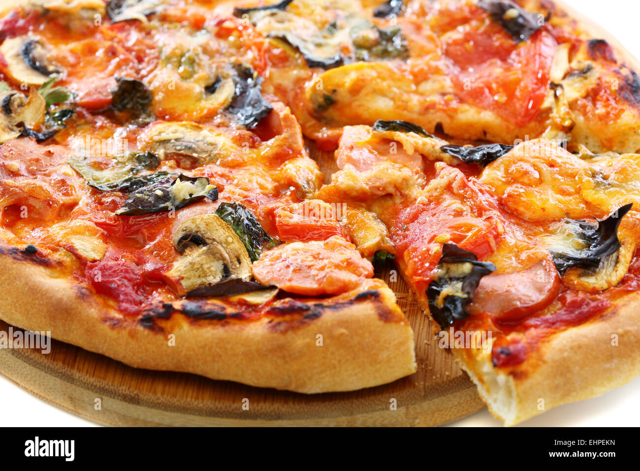 Sliced pizza with tomato hi-res stock photography and images - Alamy