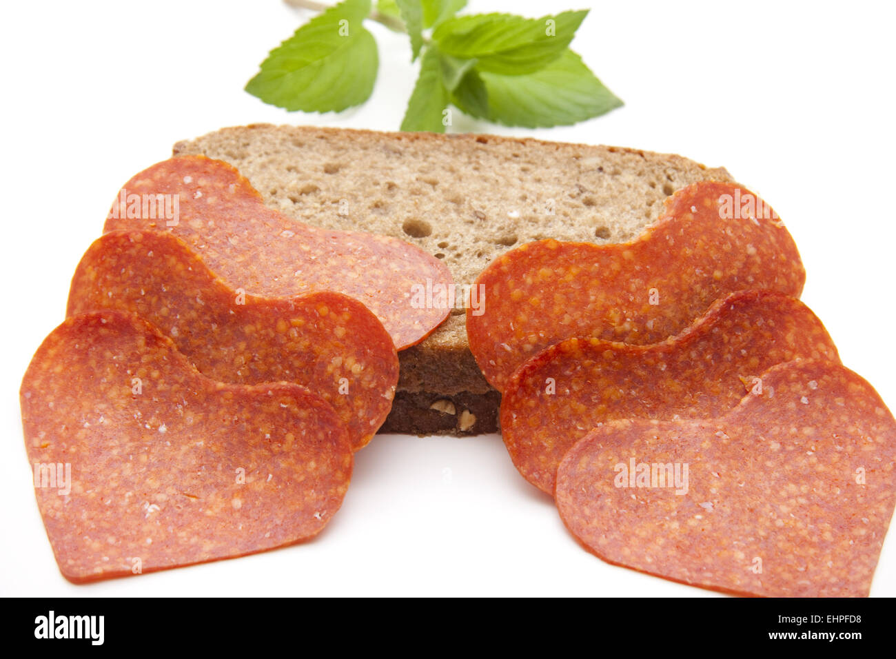 Turkeys salami on bread with mint Stock Photo - Alamy