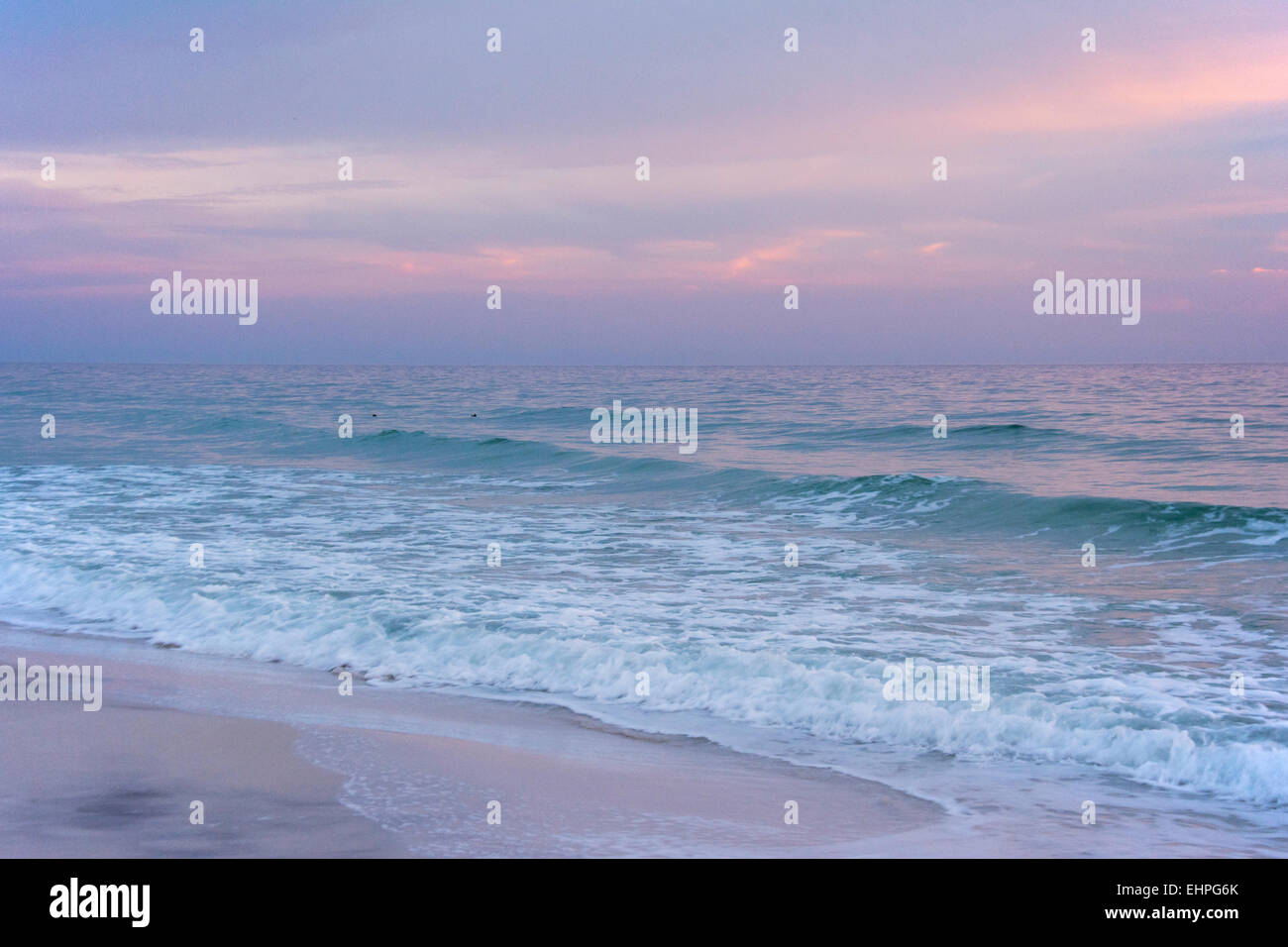 Subtle shades of sky, surf and sand Stock Photo - Alamy